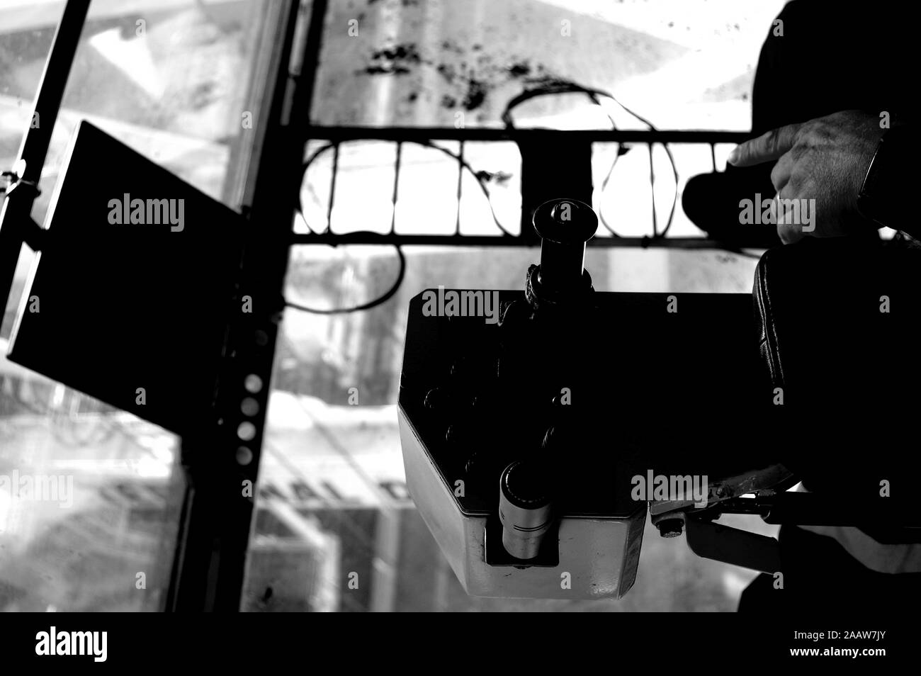 Gantry crane operator moving a sea container in the Port Stock Photo ...