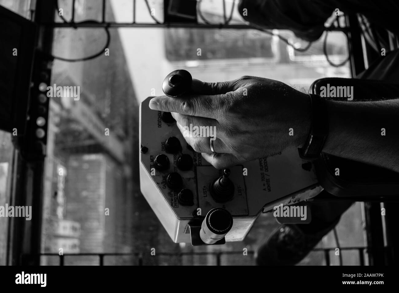 Gantry crane operator moving a sea container in the Port Stock Photo ...