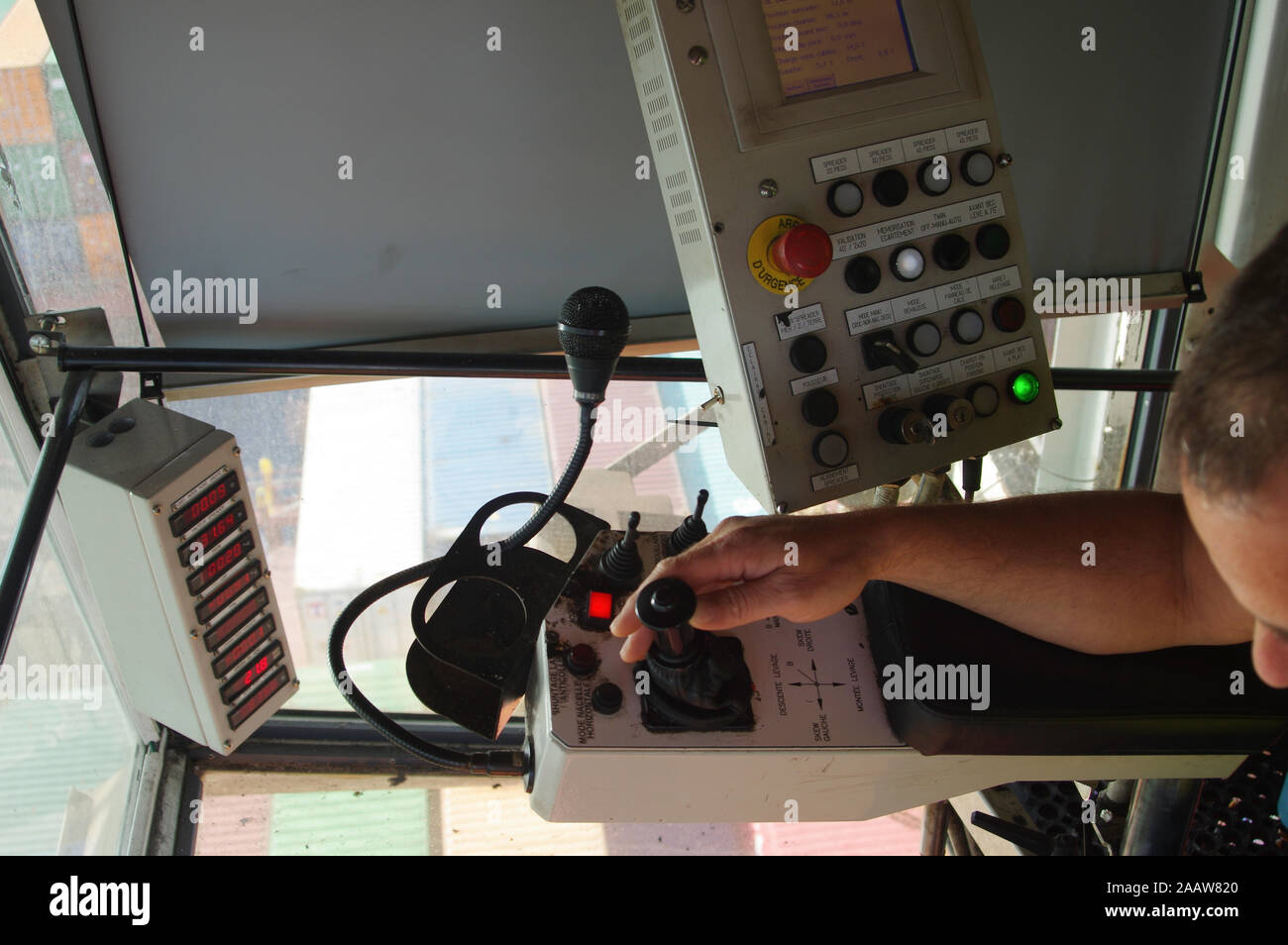 Gantry crane operator moving a sea container in the Port Stock Photo ...