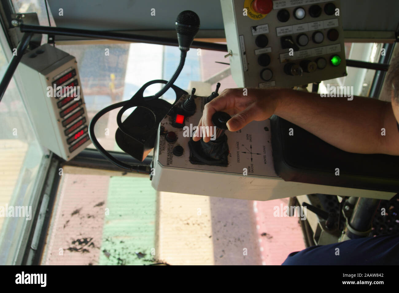 Gantry crane operator moving a sea container in the Port Stock Photo ...
