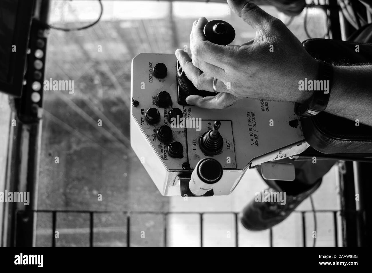 Gantry crane operator moving a sea container in the Port Stock Photo ...
