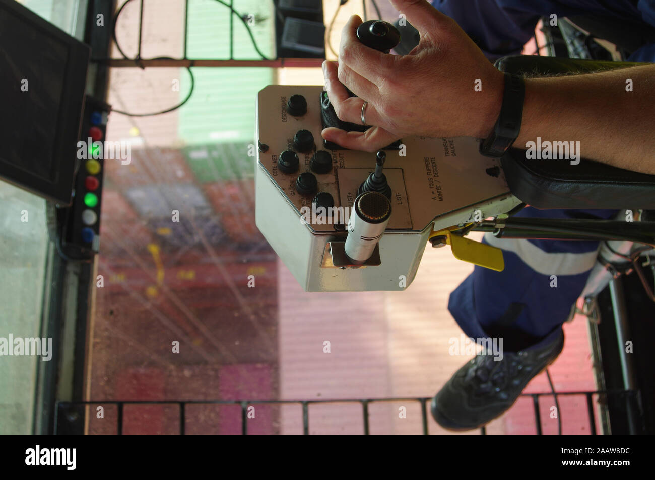Gantry crane operator moving a sea container in the Port Stock Photo ...