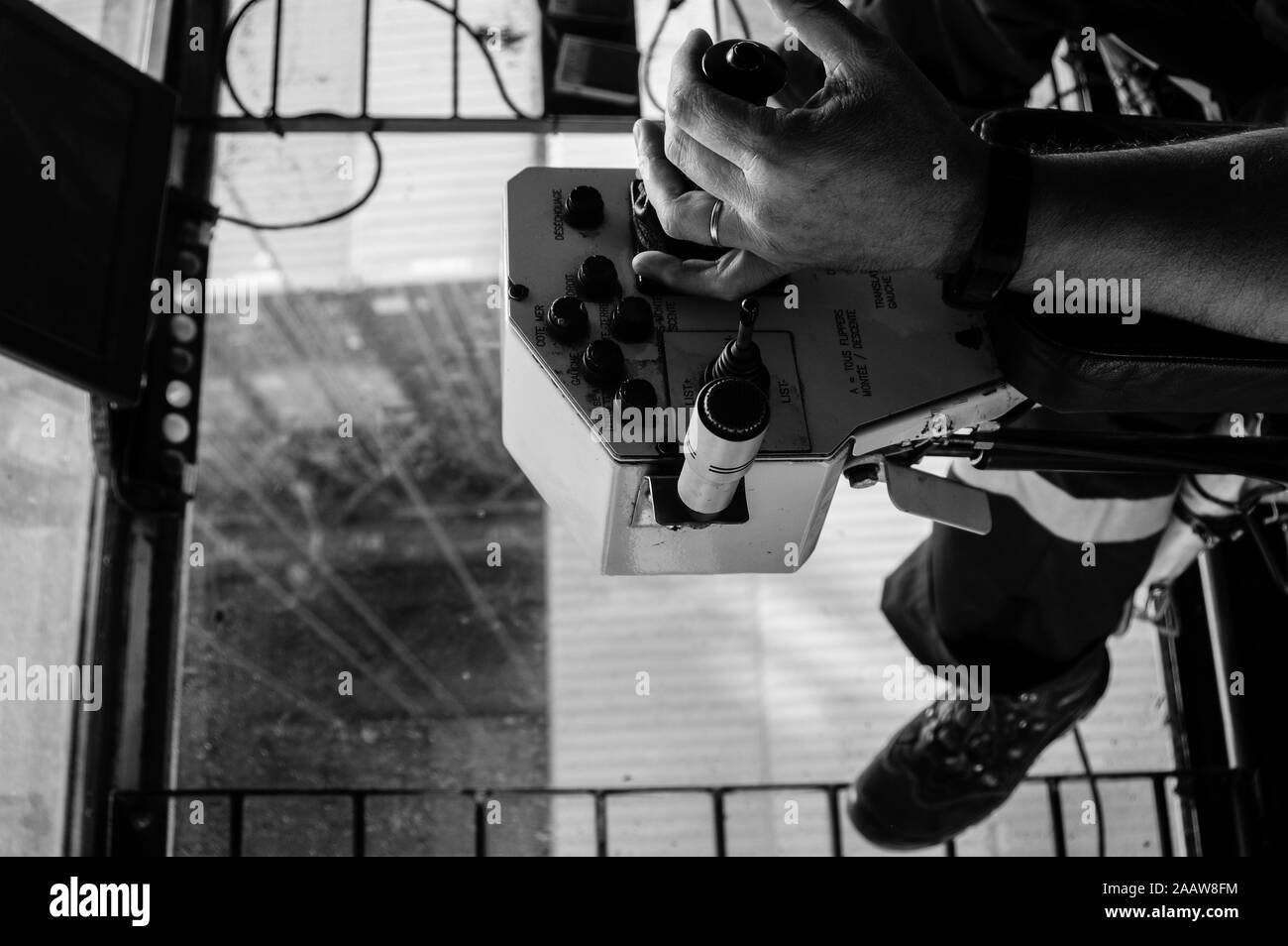 Gantry crane operator moving a sea container in the Port Stock Photo ...