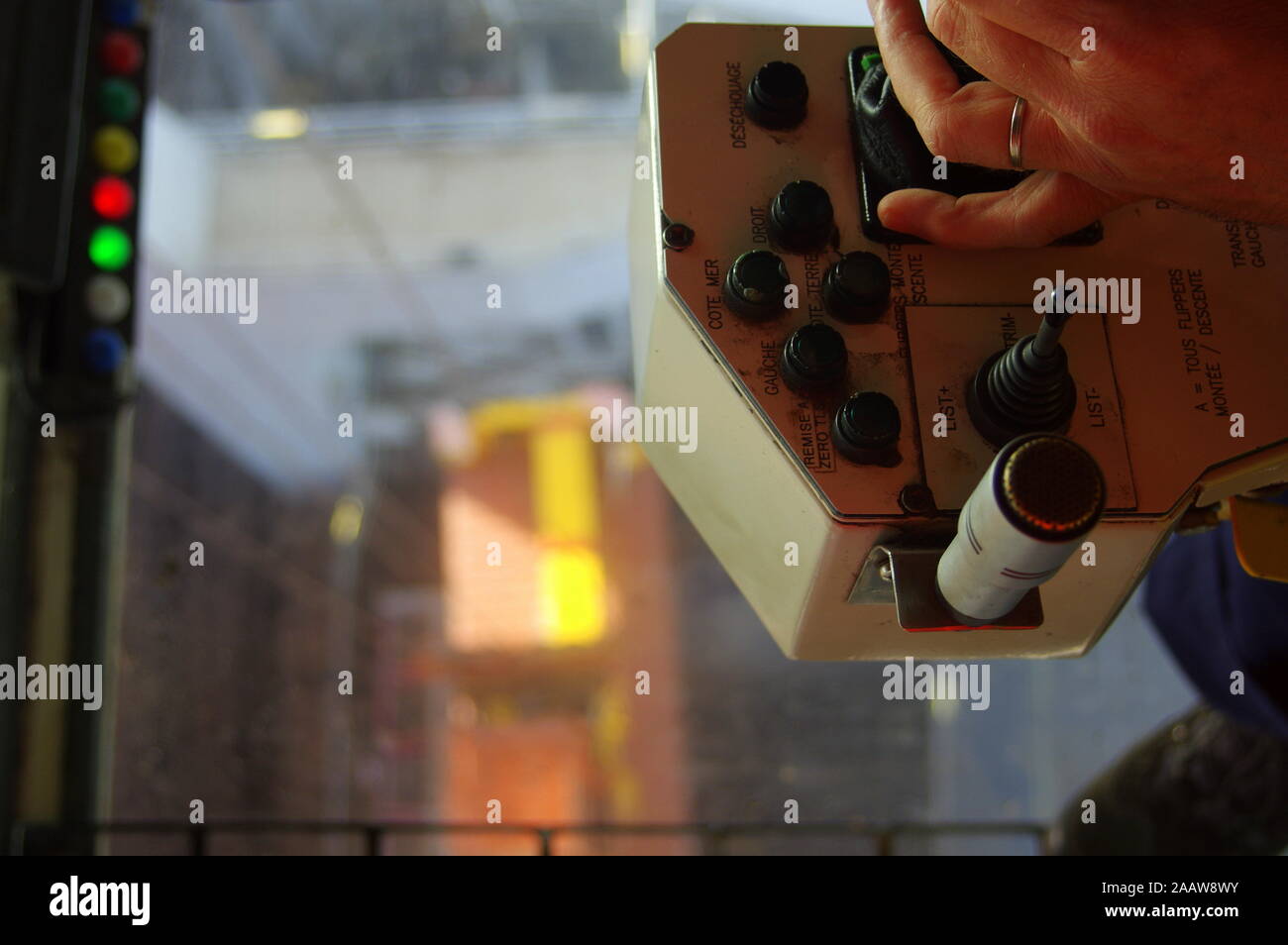 Gantry crane operator moving a sea container in the Port Stock Photo ...
