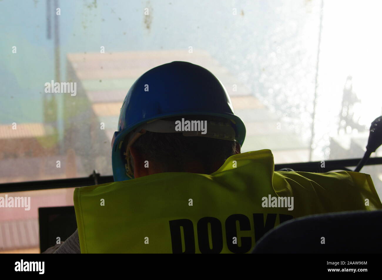Gantry crane operator moving a sea container in the Port Stock Photo ...