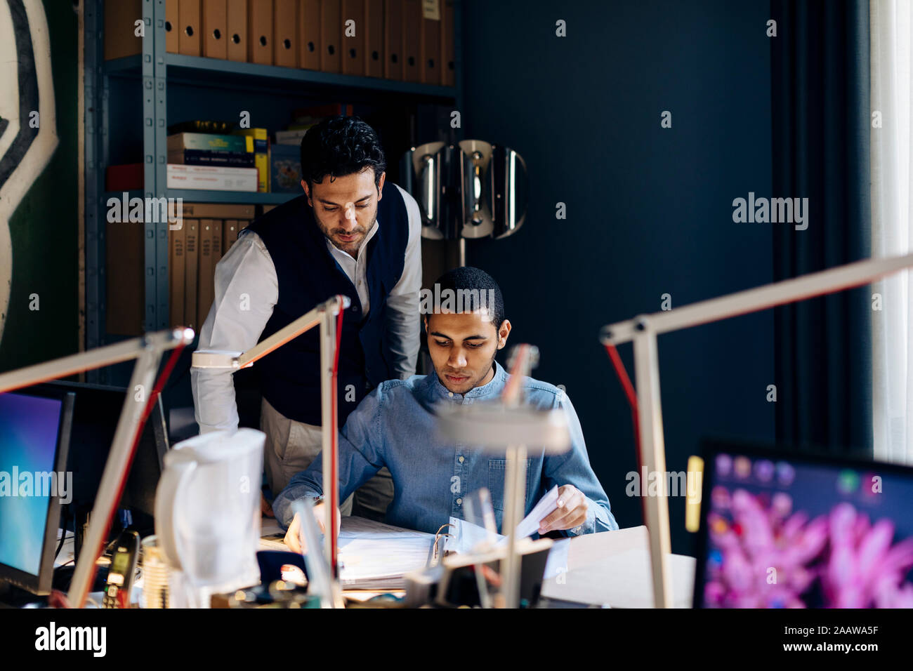 Colleague assisting business team hi-res stock photography and images ...