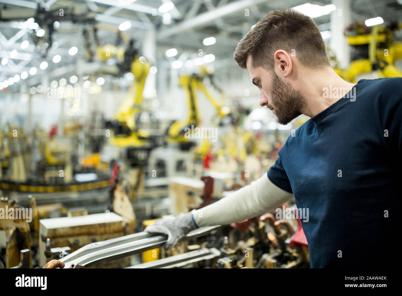 Man working in a modern factory Stock Photo - Alamy