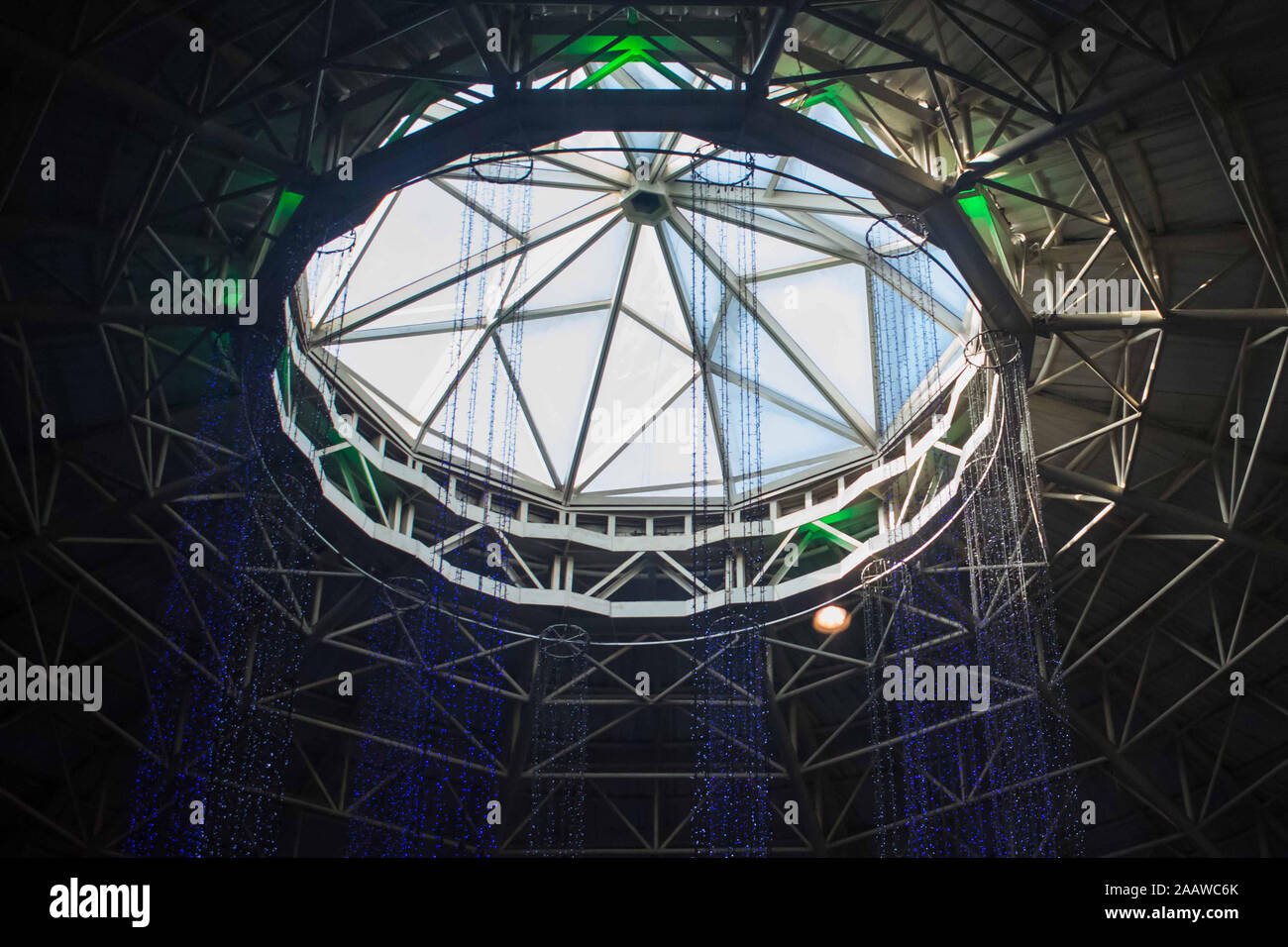 Steel round roofing with a sky light. Christmas lights hanging from the ...