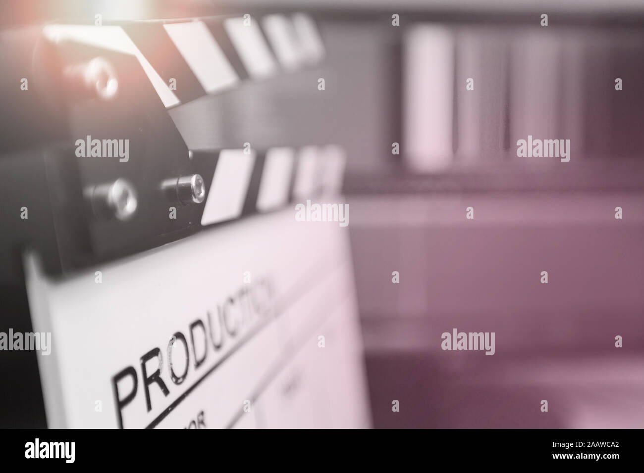 Movie clapper and editing room in background Stock Photo - Alamy
