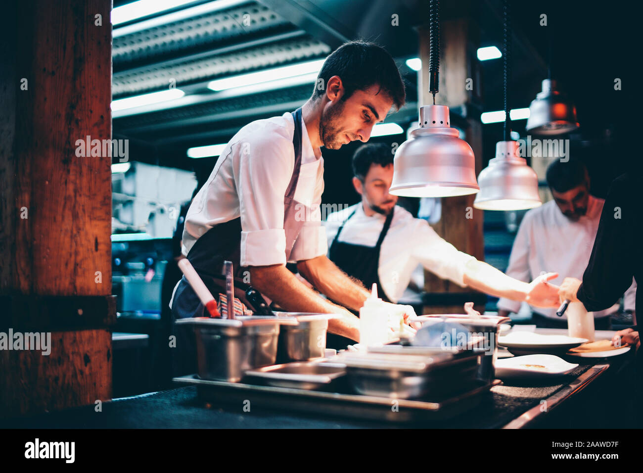 Cook serving hi-res stock photography and images - Alamy