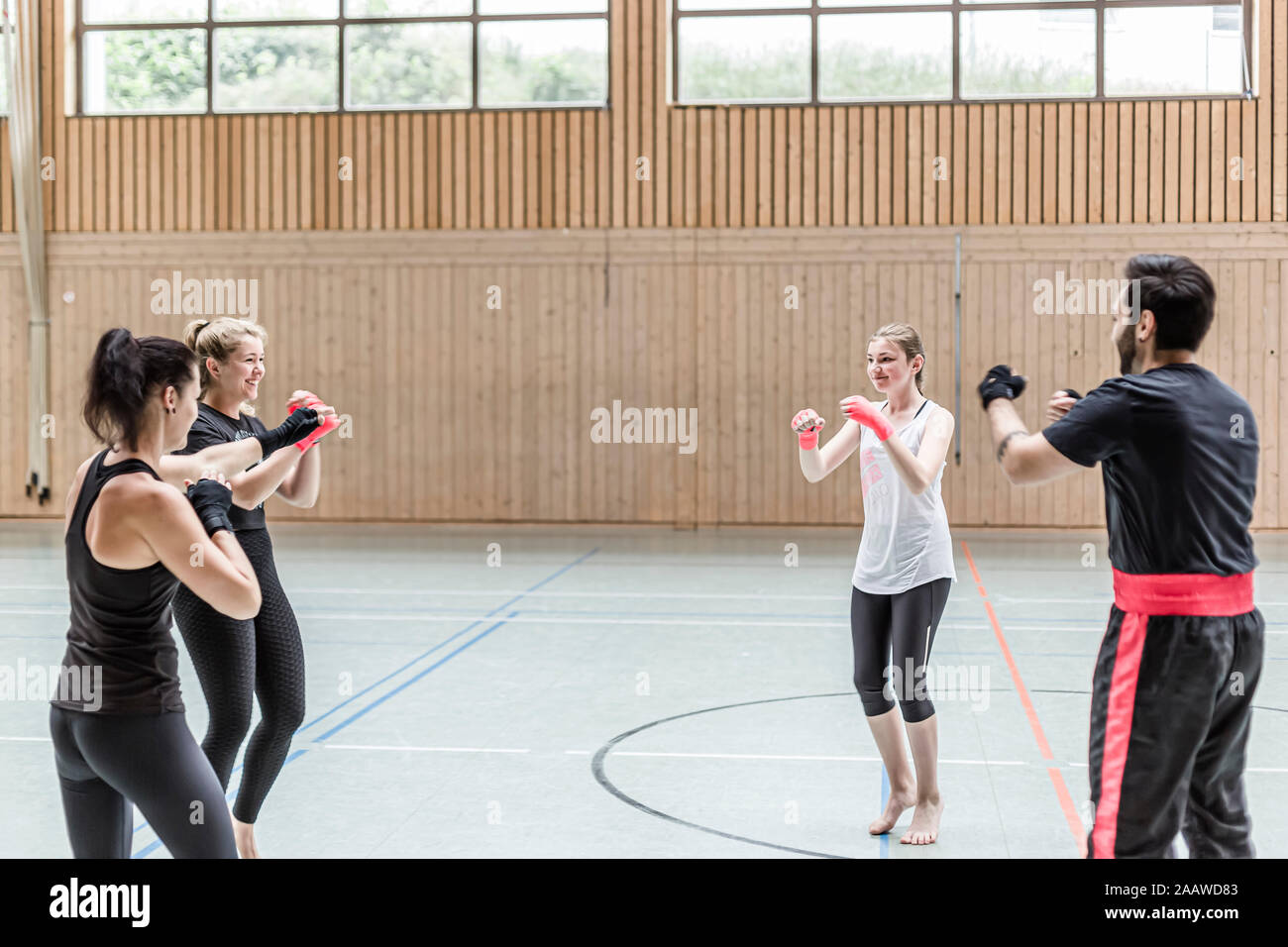 Group of boxers warming up in sports hall Stock Photo - Alamy