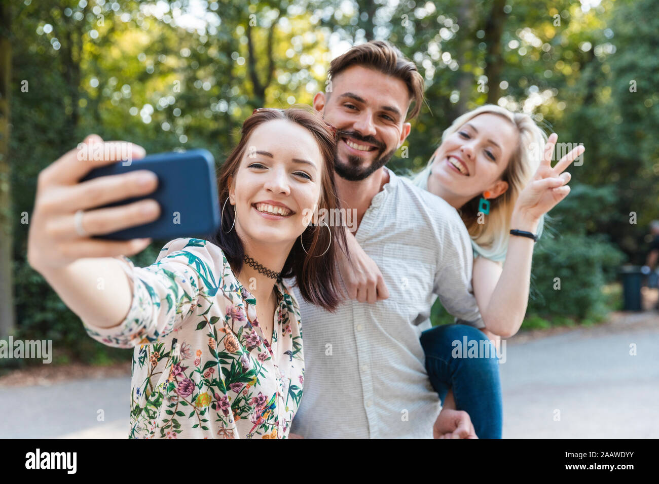 Group of three friends taking selfie with smartphone Stock Photo - Alamy