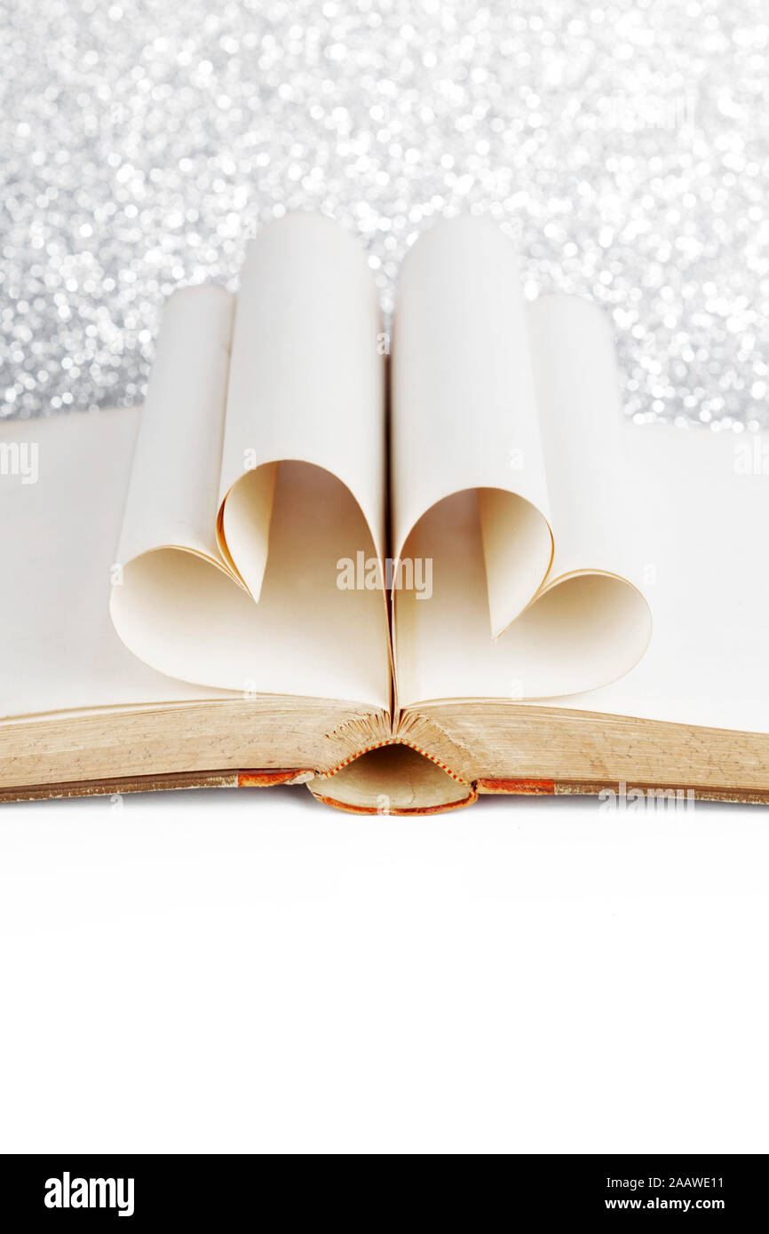 Book with opened pages and shape of heart love reading concept Stock ...