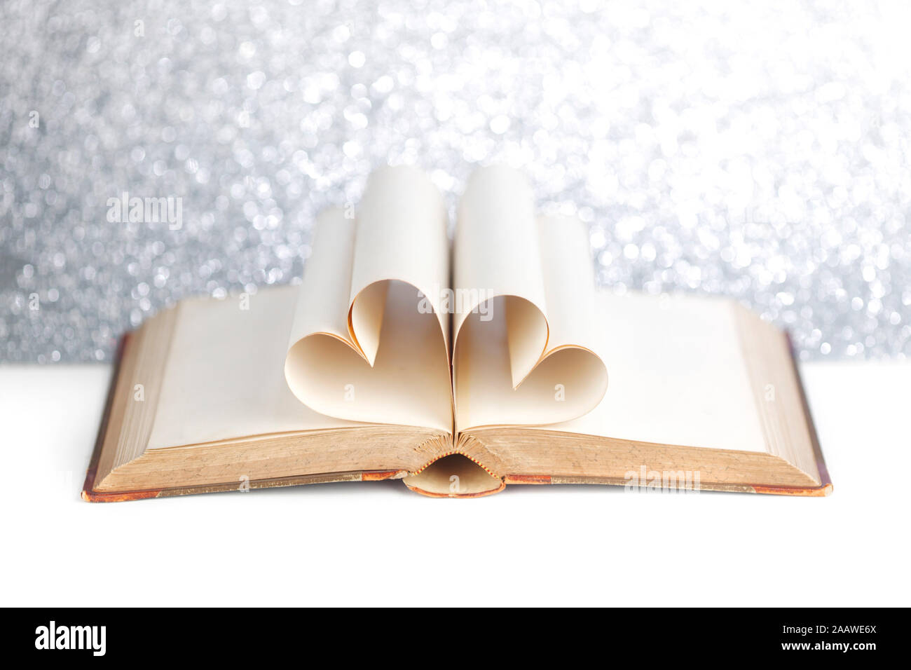 Book with opened pages and shape of heart love reading concept Stock ...