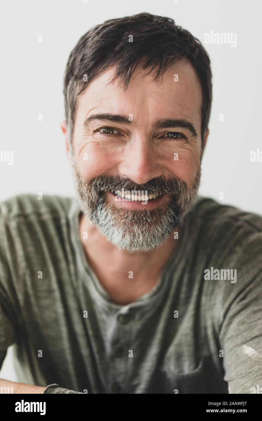 Portrait of smiling mature man Stock Photo - Alamy