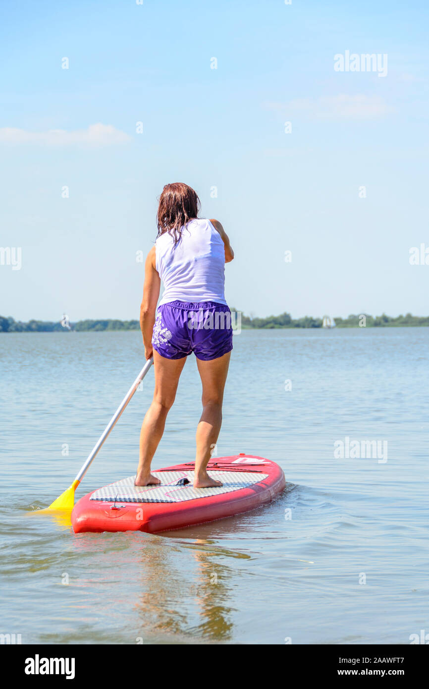 Woman paddling board hi-res stock photography and images - Alamy
