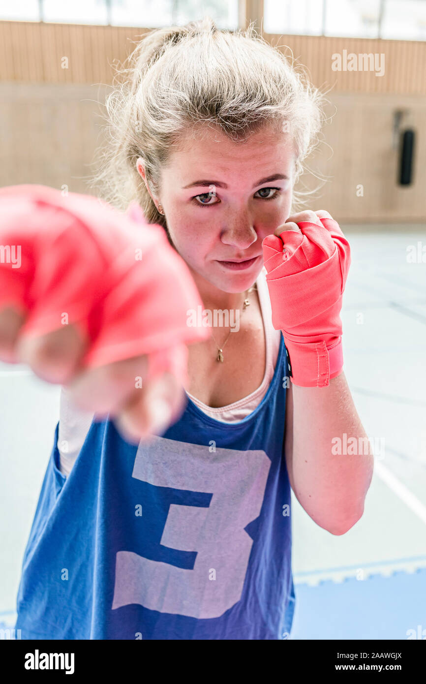 Portrait of confident female boxer in sports hall Stock Photo - Alamy