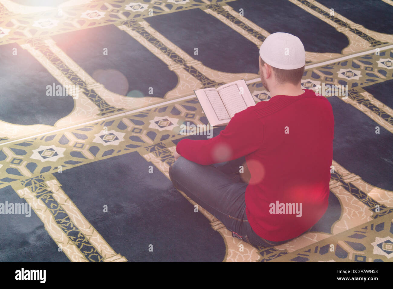 Muslim man reciting from holy book Koran, Qoran, islamic religious book ...