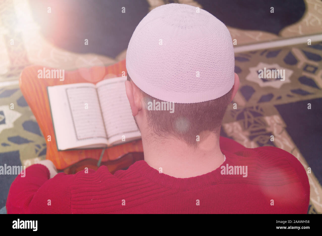 Muslim man reciting from holy book Koran, Qoran, islamic religious book ...