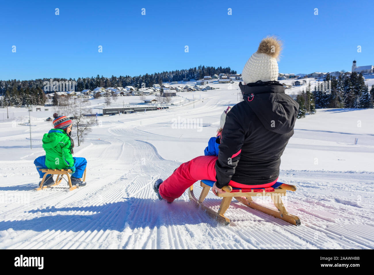 Funny afternoon in wintertime on sleigh slope Stock Photo - Alamy