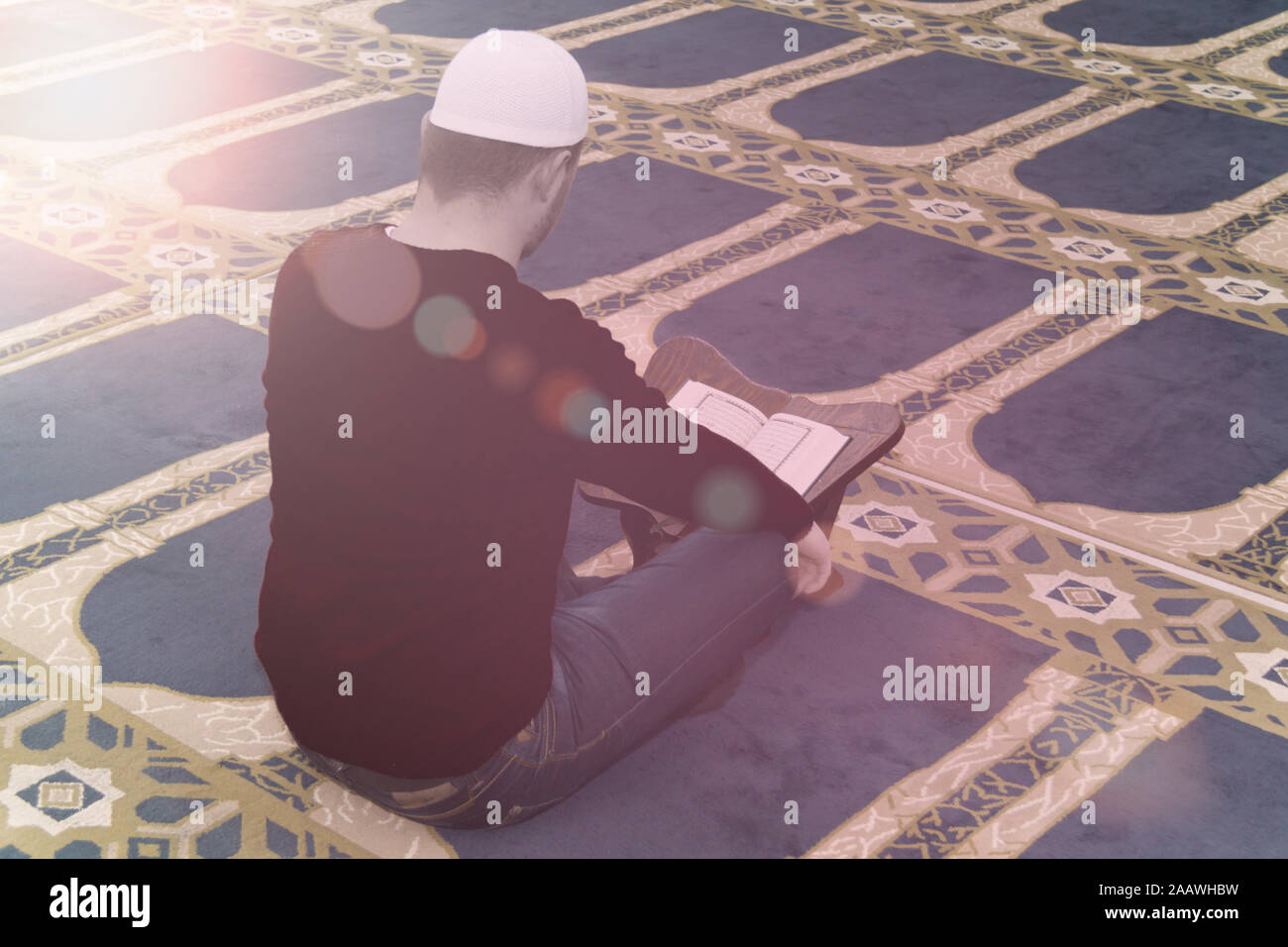 Muslim man reciting from holy book Koran, Qoran, islamic religious book ...