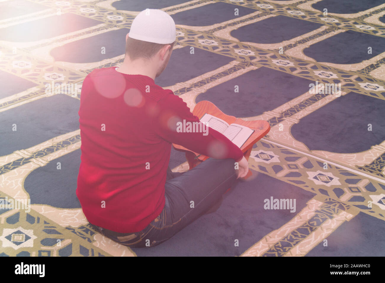 Muslim man reciting from holy book Koran, Qoran, islamic religious book ...