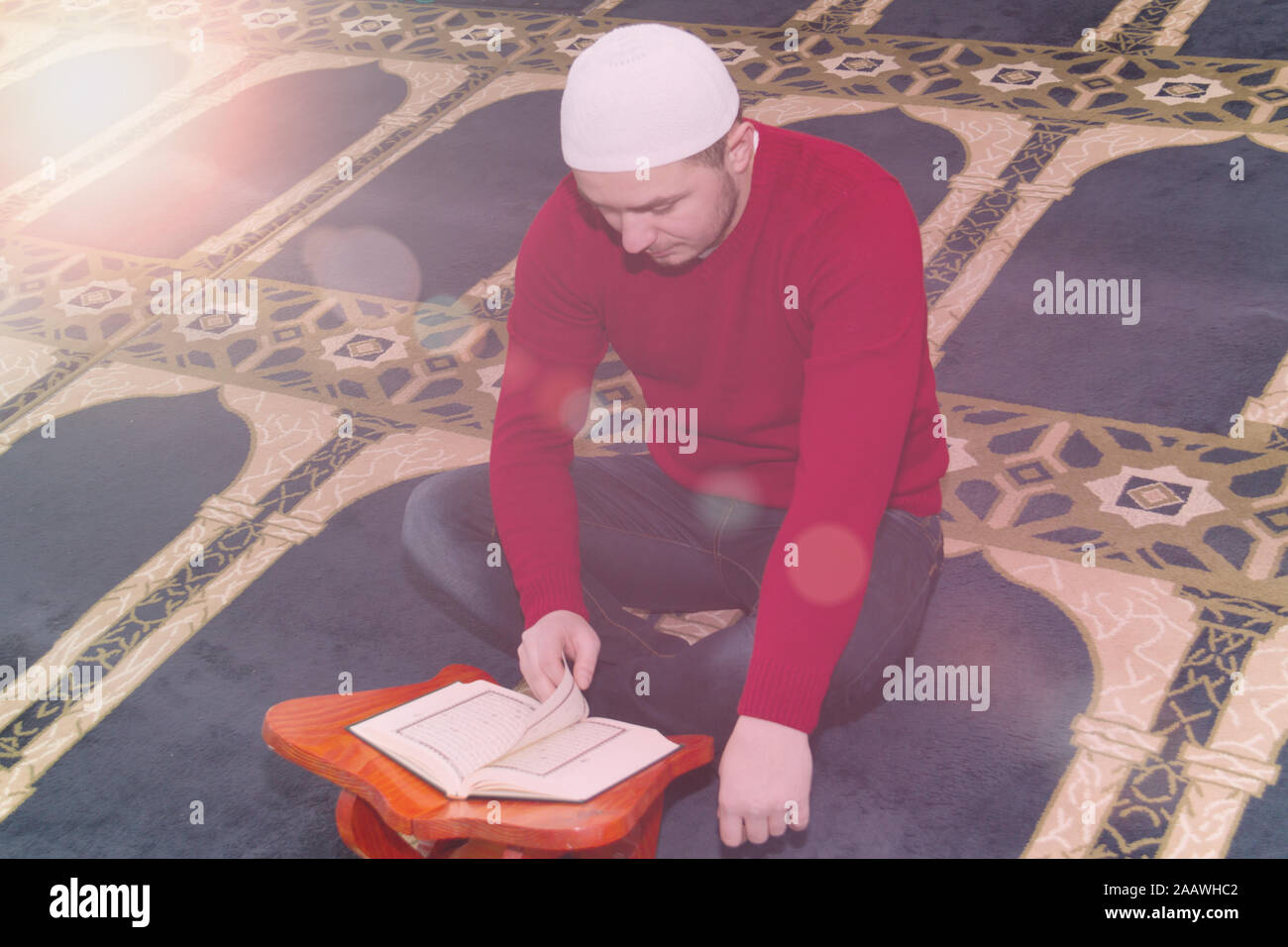 Muslim man reciting from holy book Koran, Qoran, islamic religious book ...