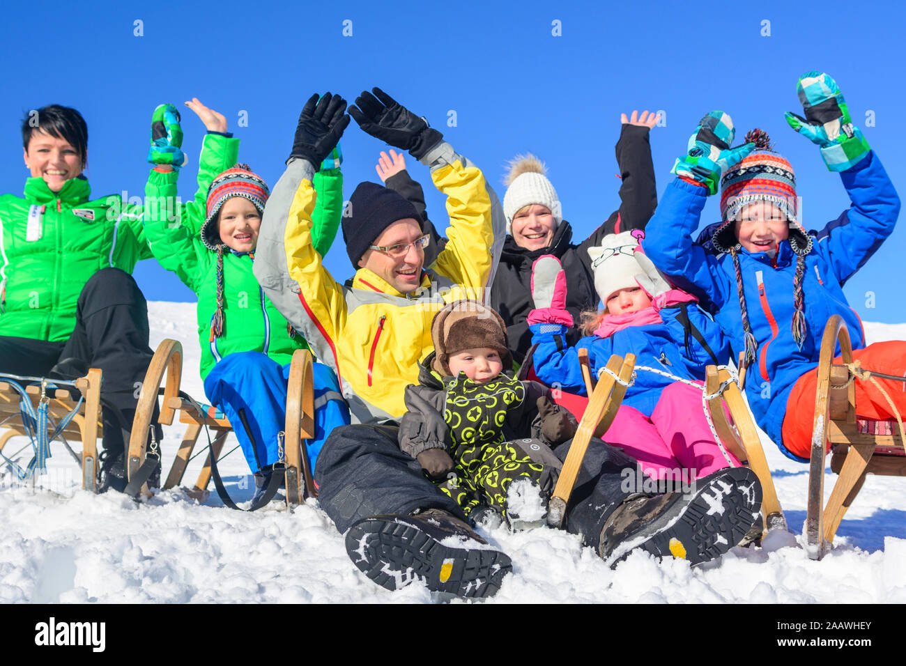 Funny afternoon in wintertime on sleigh slope Stock Photo - Alamy