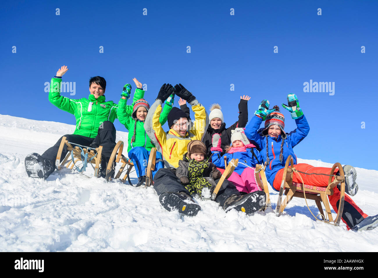 Funny afternoon in wintertime on sleigh slope Stock Photo - Alamy