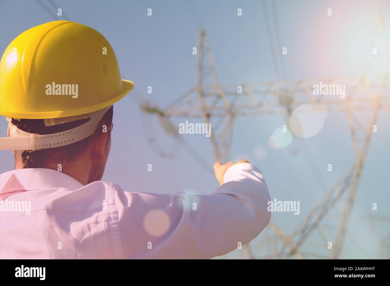 Male engineer standing at electricity station Stock Photo - Alamy
