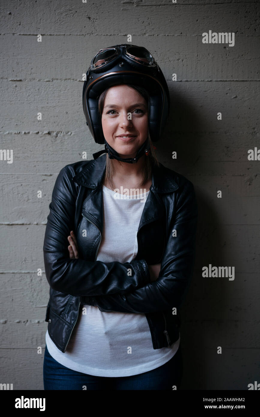 Portrait of smiling young biker wearing Stock Photo - Alamy