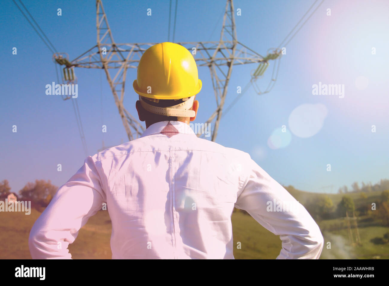 Male engineer standing at electricity station Stock Photo - Alamy