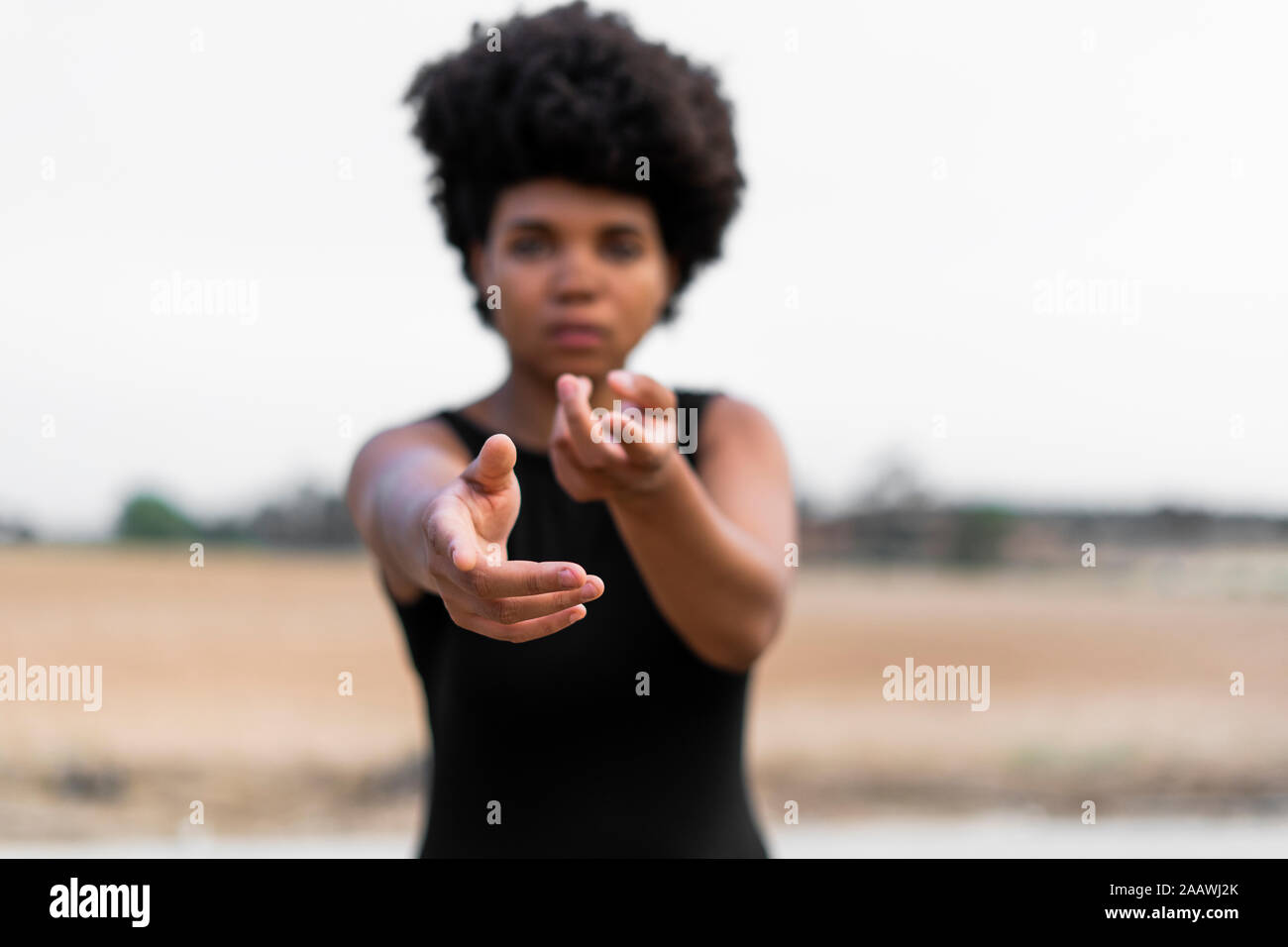 Woman's hands reaching out for help, pointing on viewer Stock Photo - Alamy