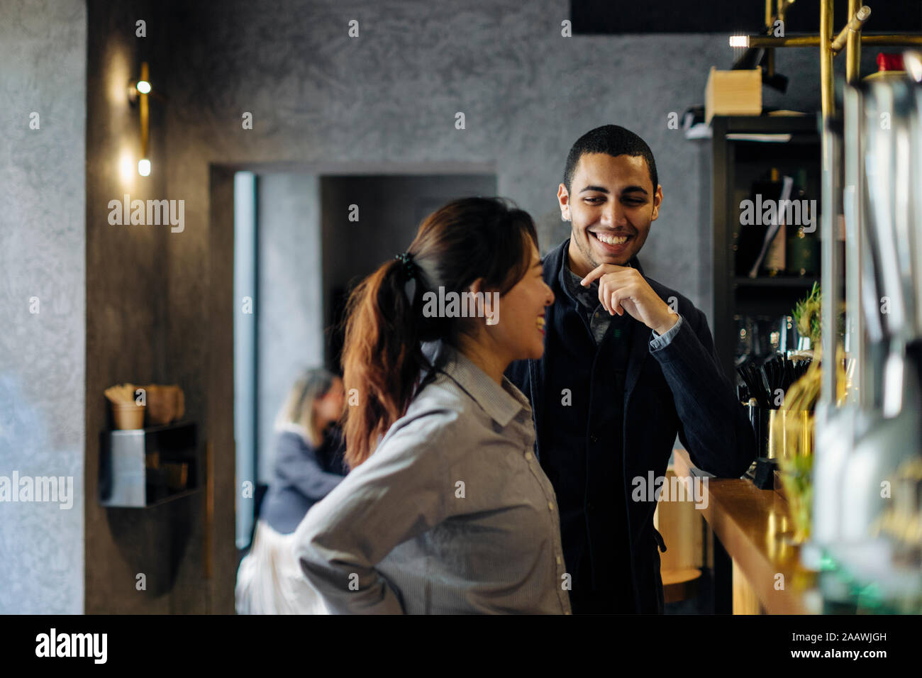 Colleagues meeting in a bar after work Stock Photo - Alamy