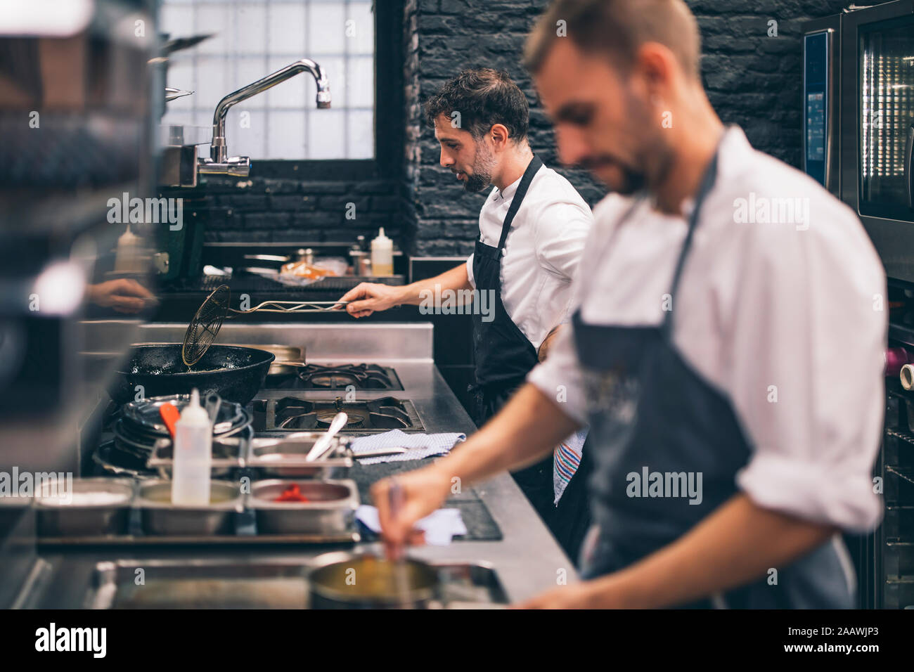 Two cooks in restaurant hi-res stock photography and images - Alamy