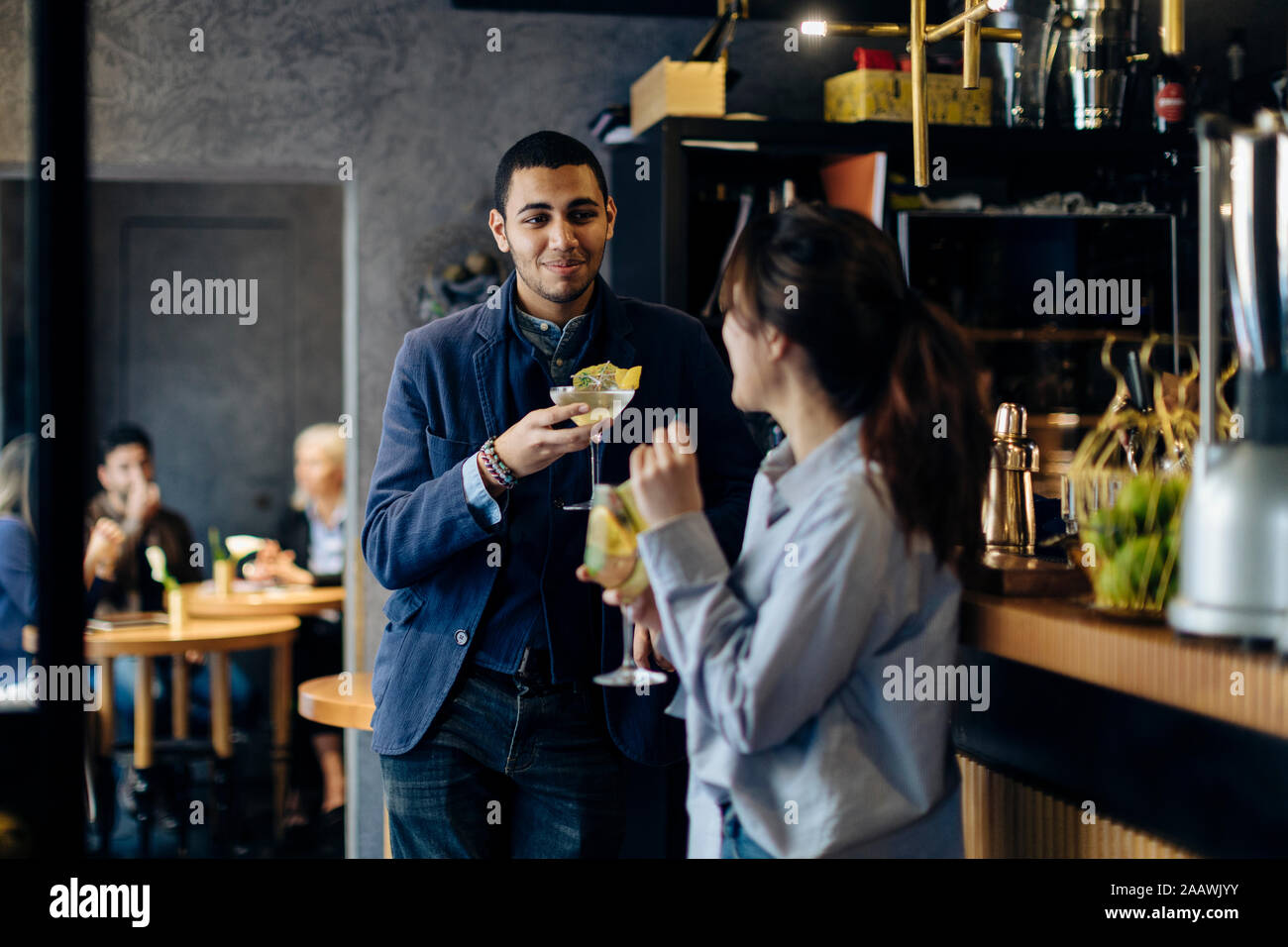 Colleagues meeting in a bar after work Stock Photo - Alamy