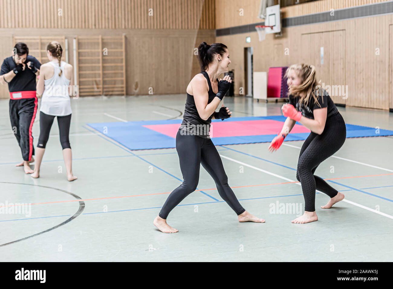 Female boxers practising in sports hall Stock Photo - Alamy