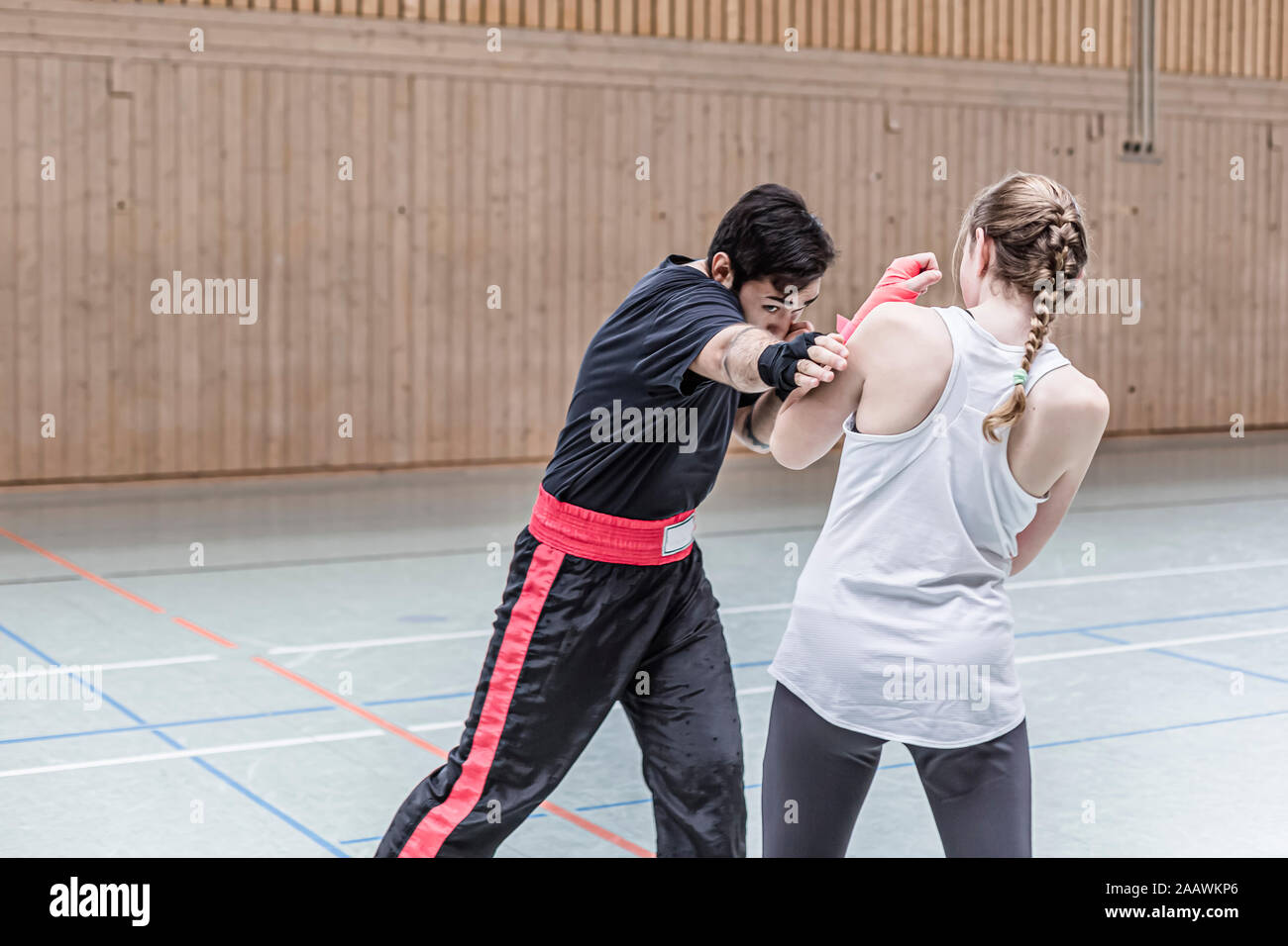 Female boxer sparring with coach in sports hall Stock Photo - Alamy