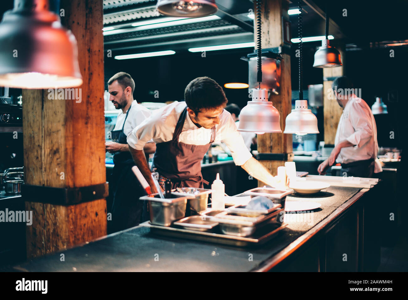 Cook serving food hi-res stock photography and images - Alamy