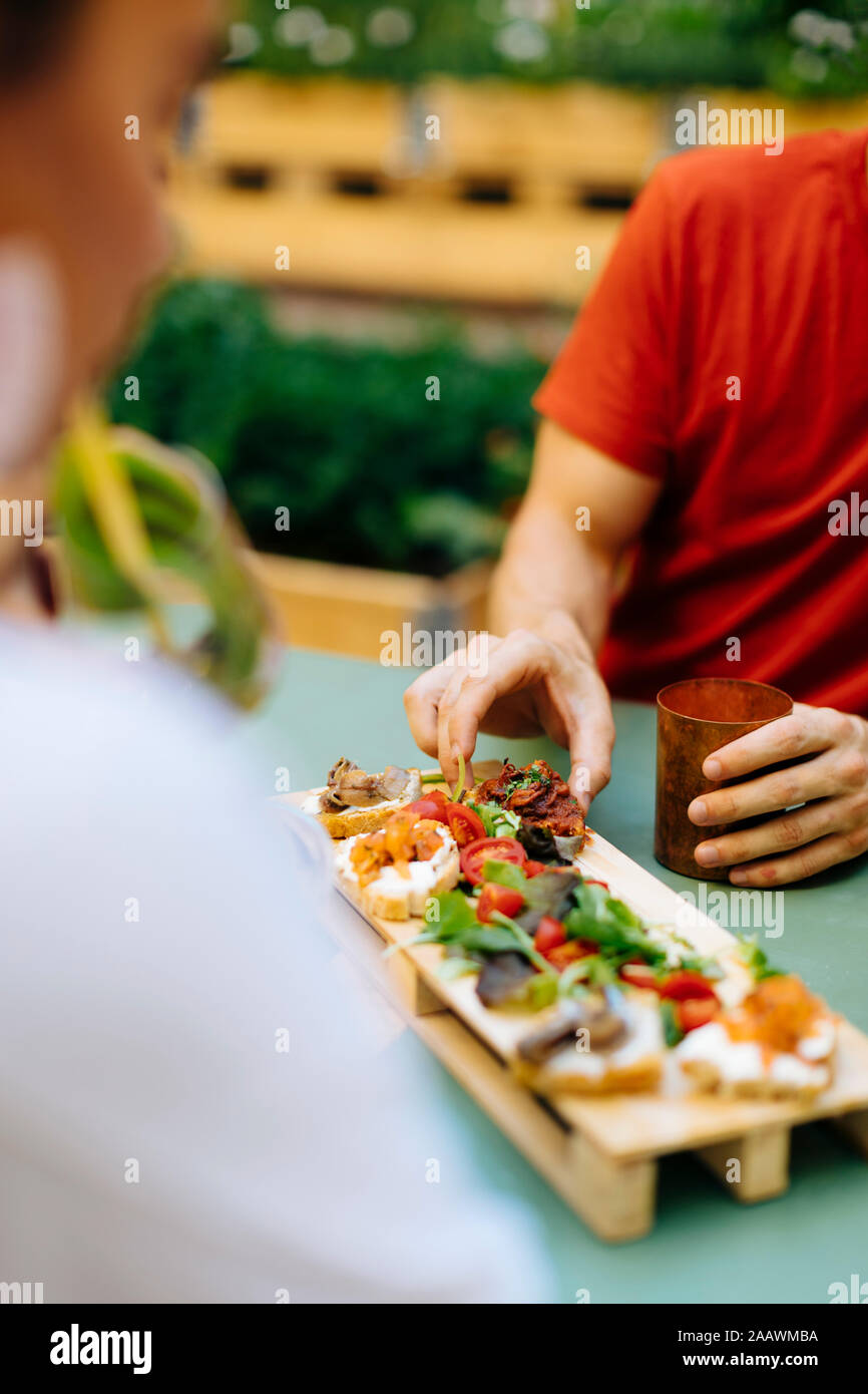 Young woman eating tapas hi-res stock photography and images - Alamy