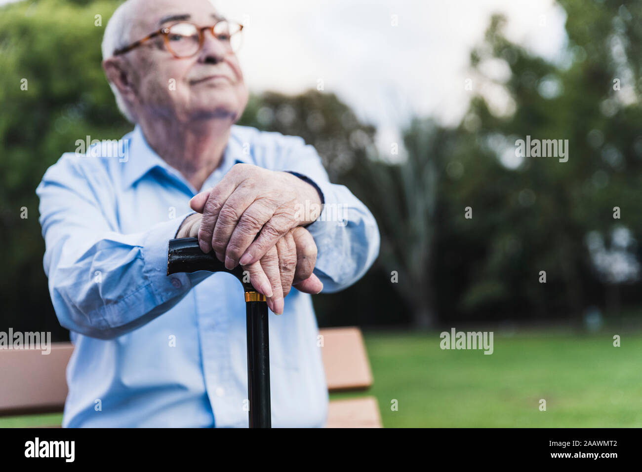 Leaning on walking stick hi-res stock photography and images - Alamy