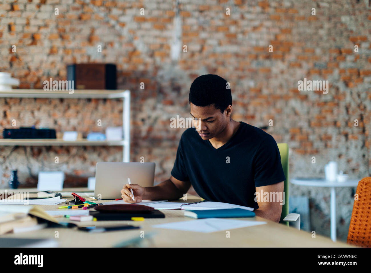 Young black man taking notes hi-res stock photography and images - Alamy