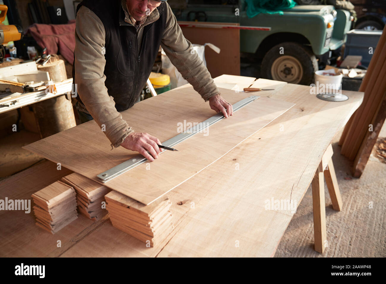 Worker measuring wood Stock Photo - Alamy