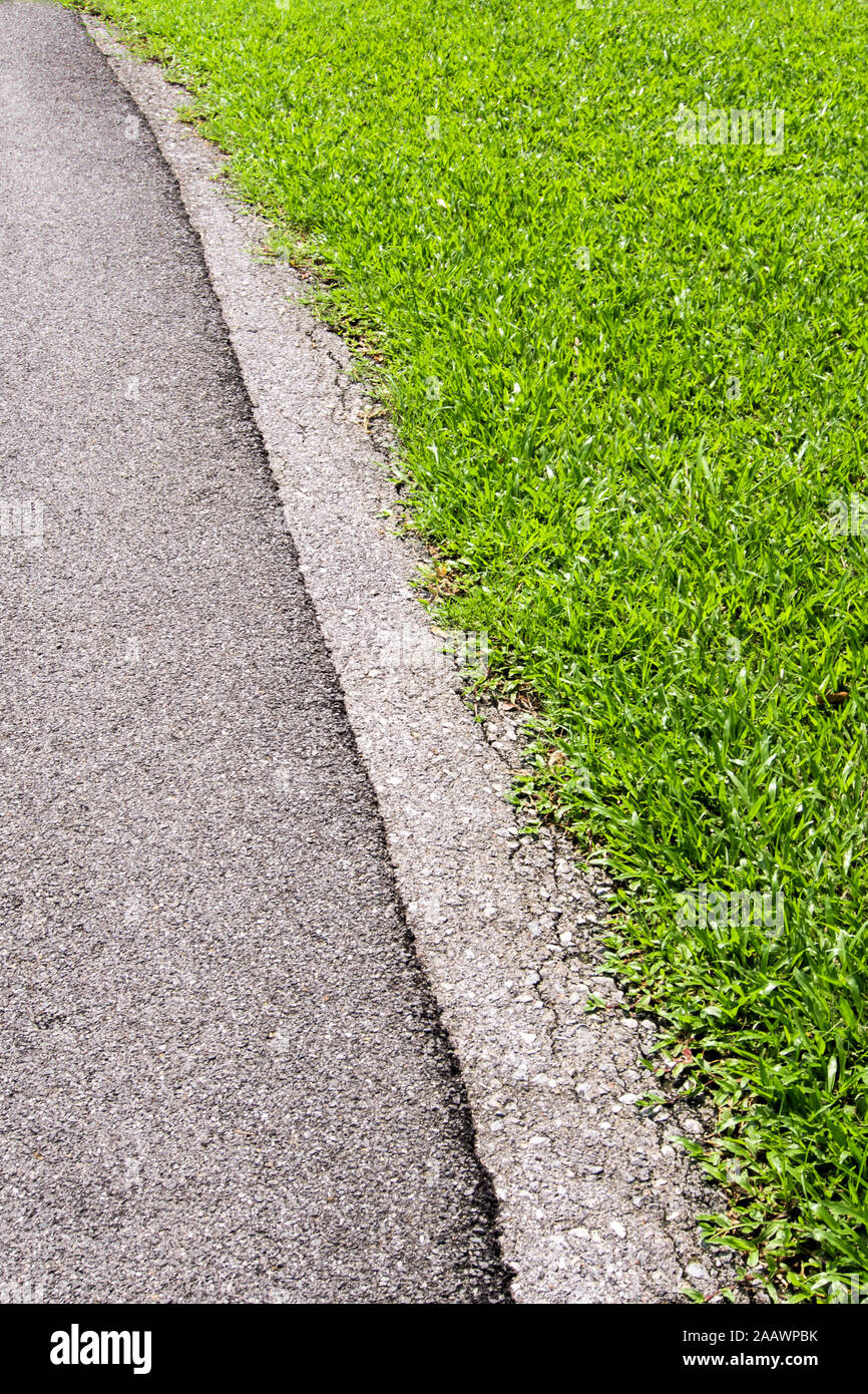 Walkways and concrete edges beside the lawn Stock Photo - Alamy
