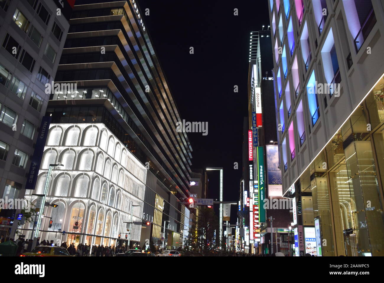 Buildings in Ginza district at night, a popular upscale shopping area ...