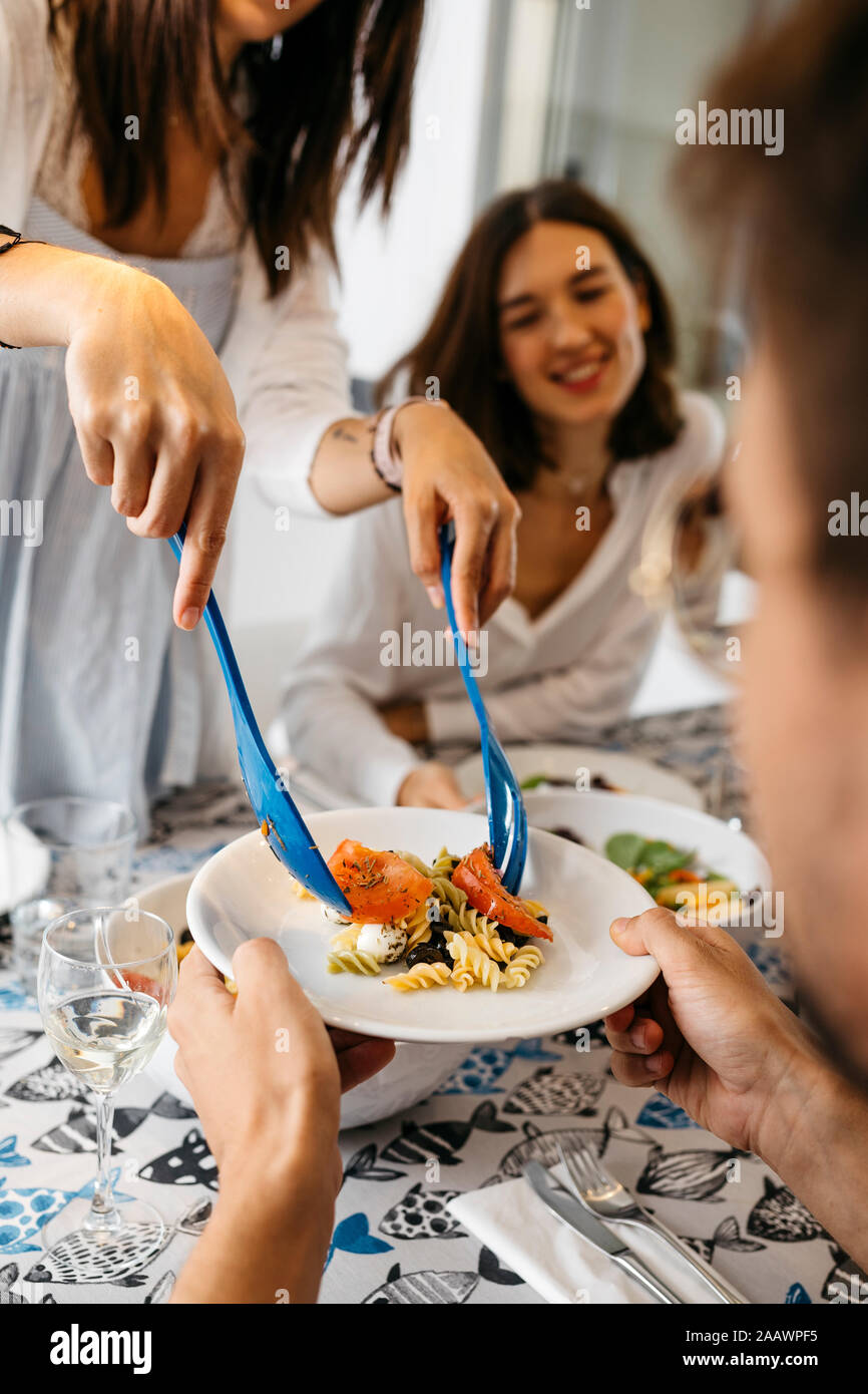 Happy friends having healthy lunch together Stock Photo - Alamy