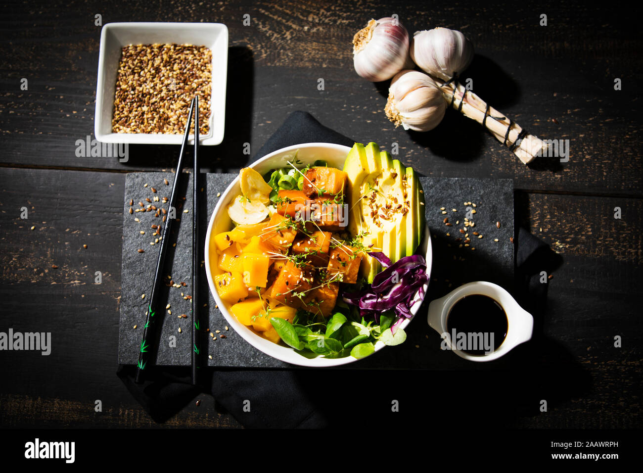 High angle view of poke bowl on wooden table Stock Photo - Alamy
