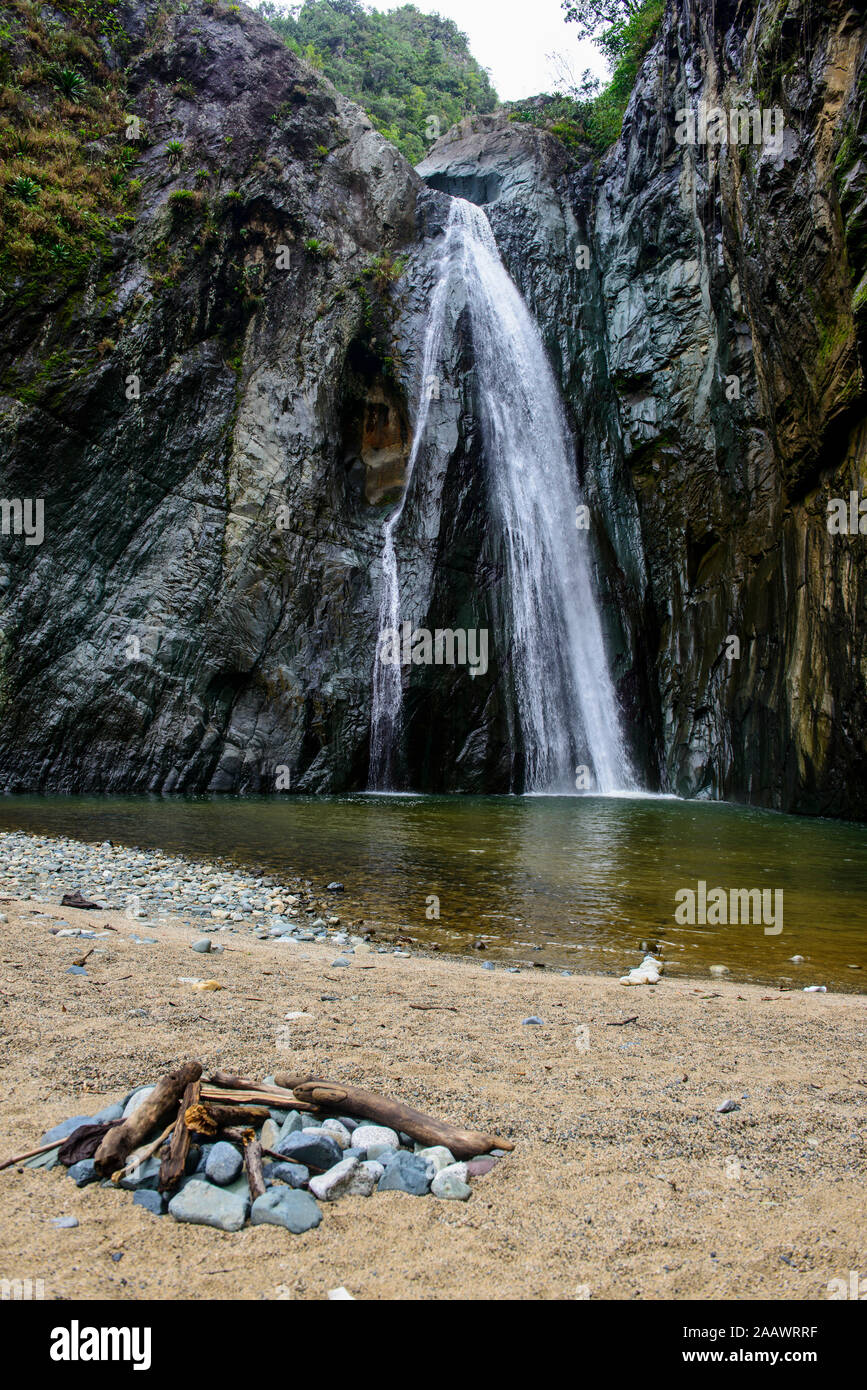 Scenic view of waterfall in forest at Jarabacoa, Dominican Republic ...