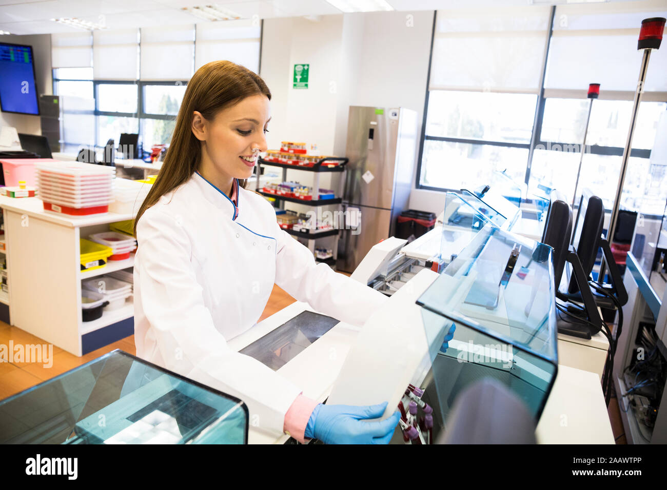 Laboratory with vials and scientists hi-res stock photography and ...