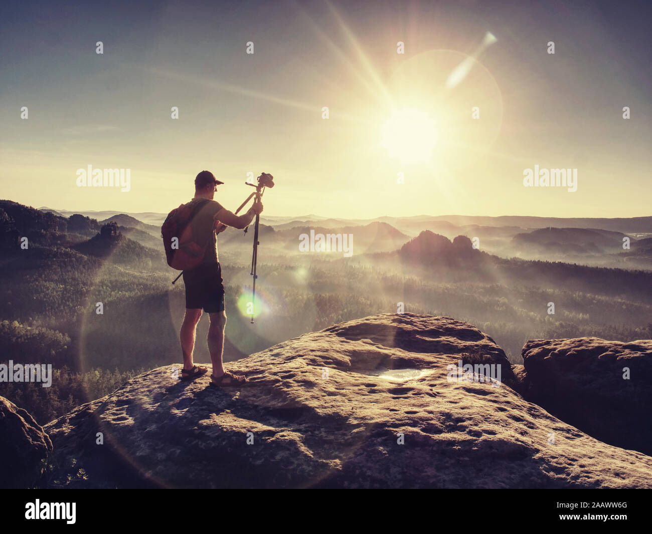 Photographer taking travel nature photography. Tall man photographer ...